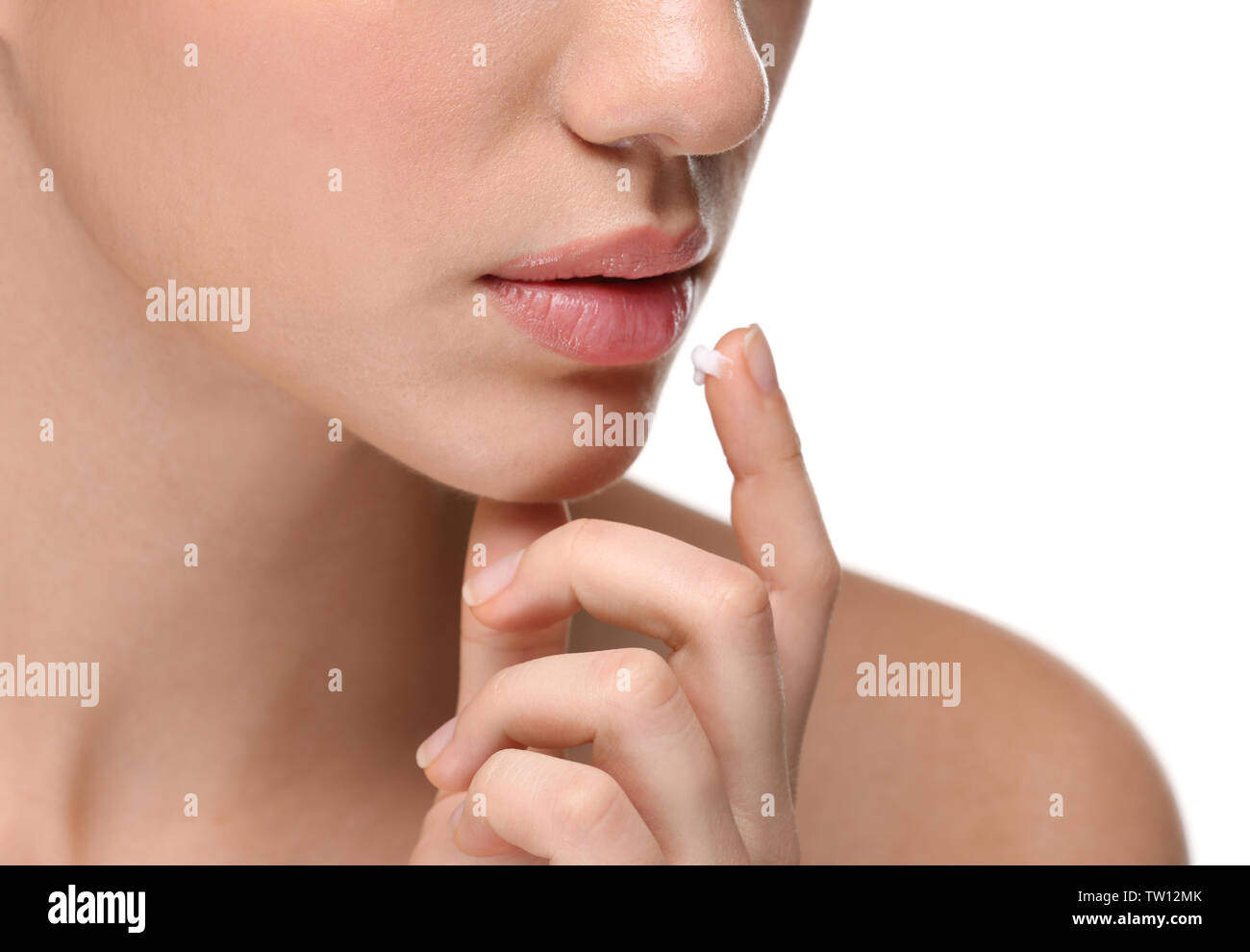 Woman applying cream onto lips on white background Stock Photo - Alamy