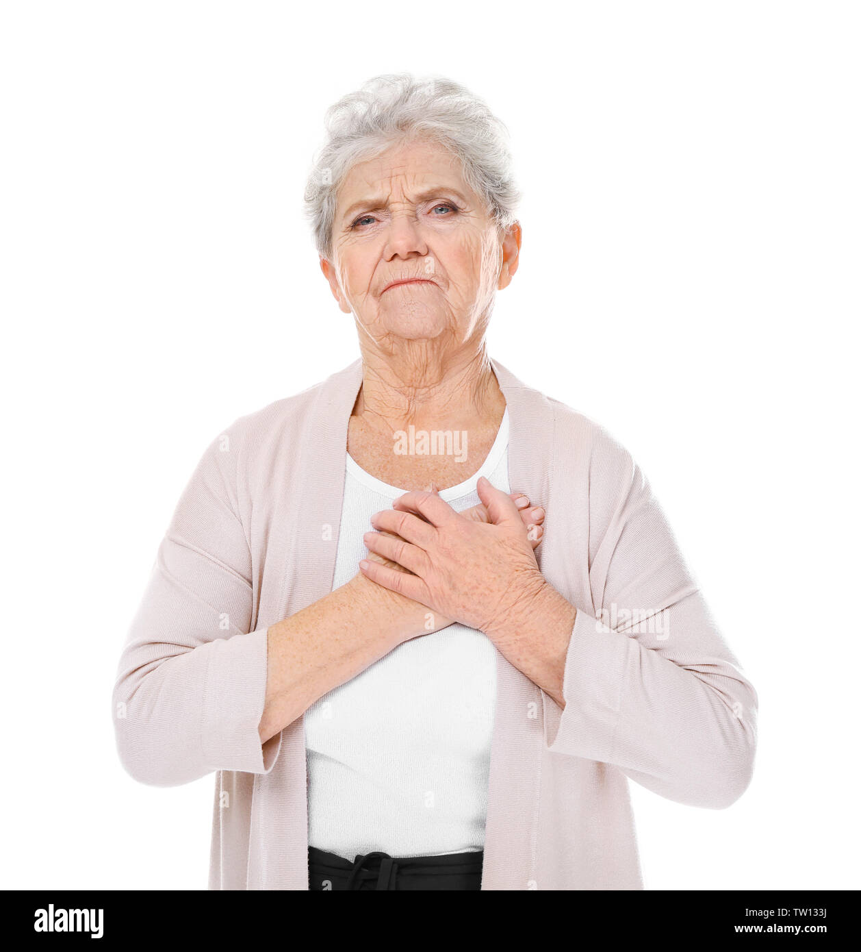 Elderly woman having heart attack on white background Stock Photo - Alamy