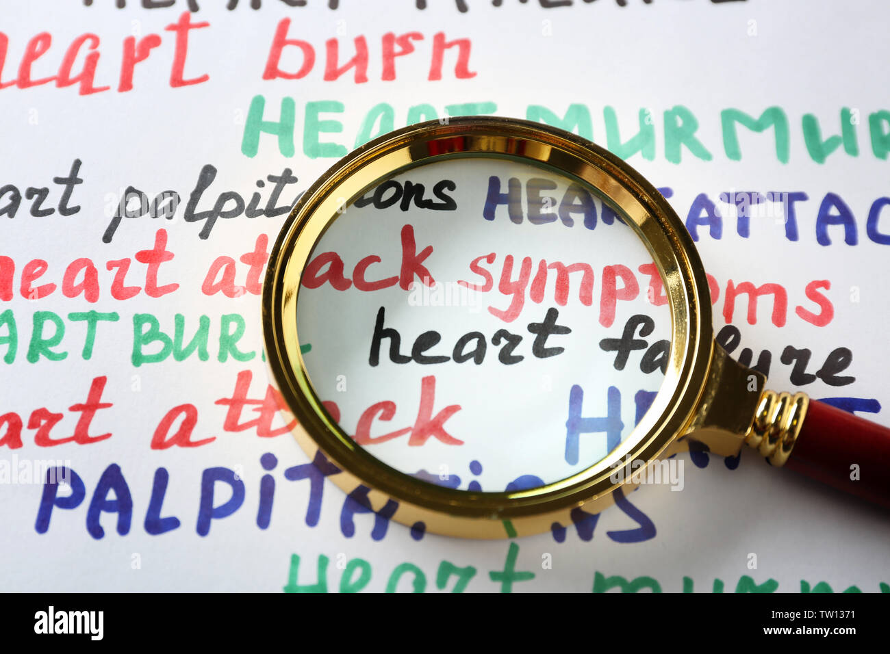 Magnifier on heart attack medical message background Stock Photo - Alamy