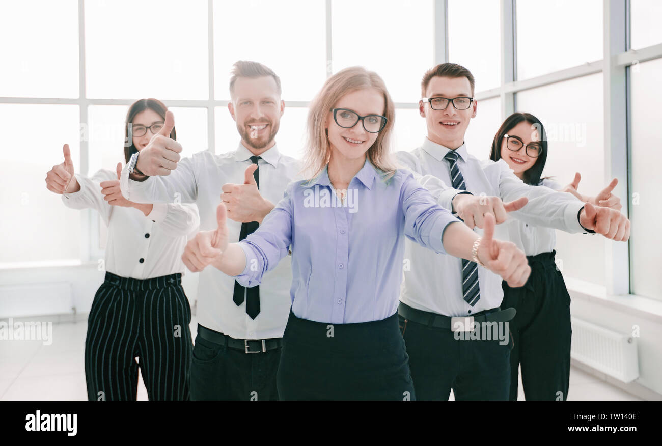 happy business team showing their thumbs up. concept of success Stock ...