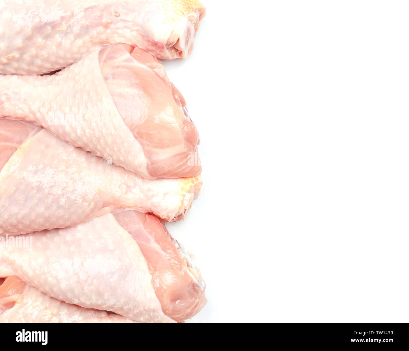 Raw chicken legs on white background Stock Photo - Alamy