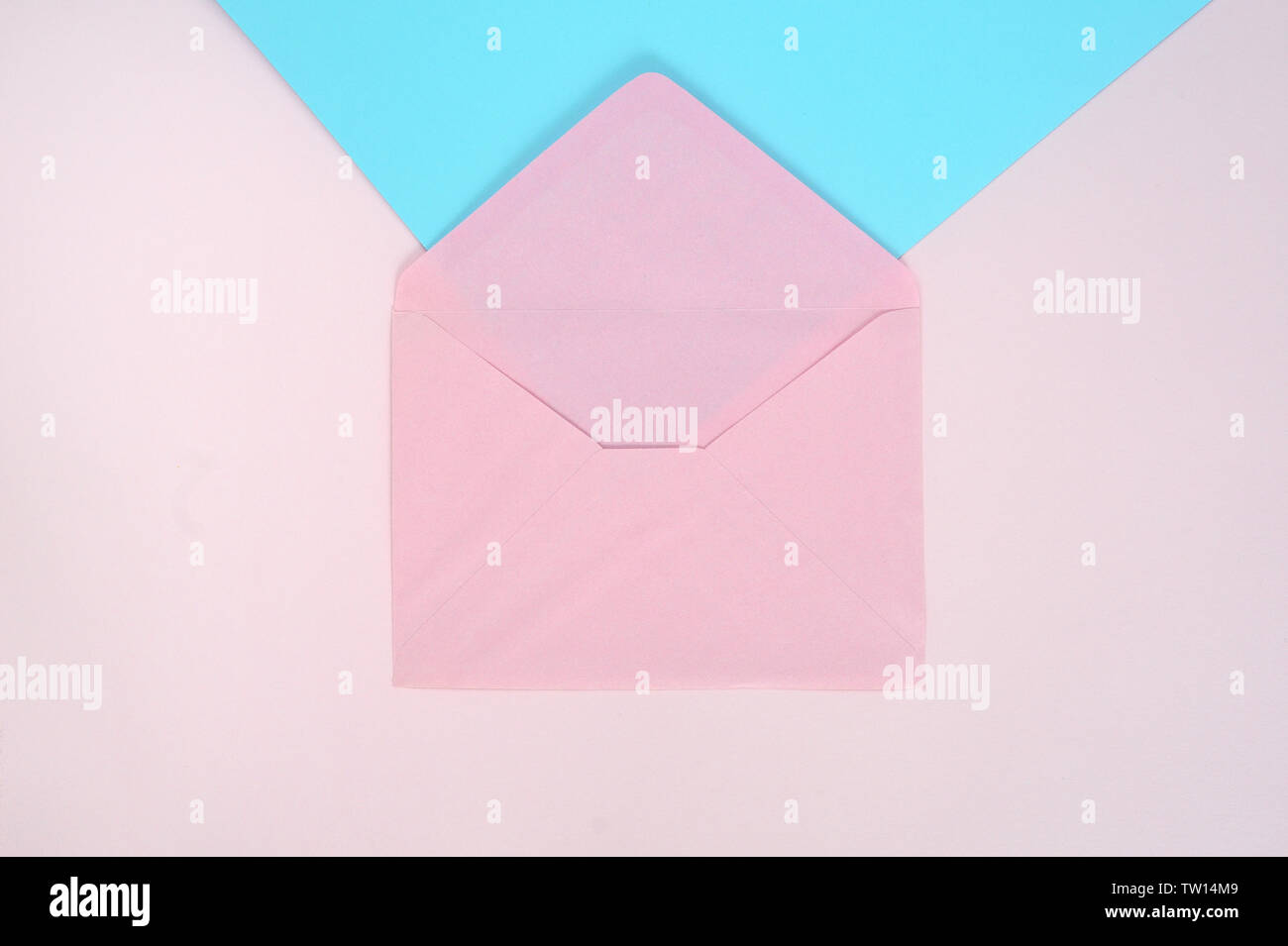 Open pink envelope on pink and blue background. Top view Stock Photo ...