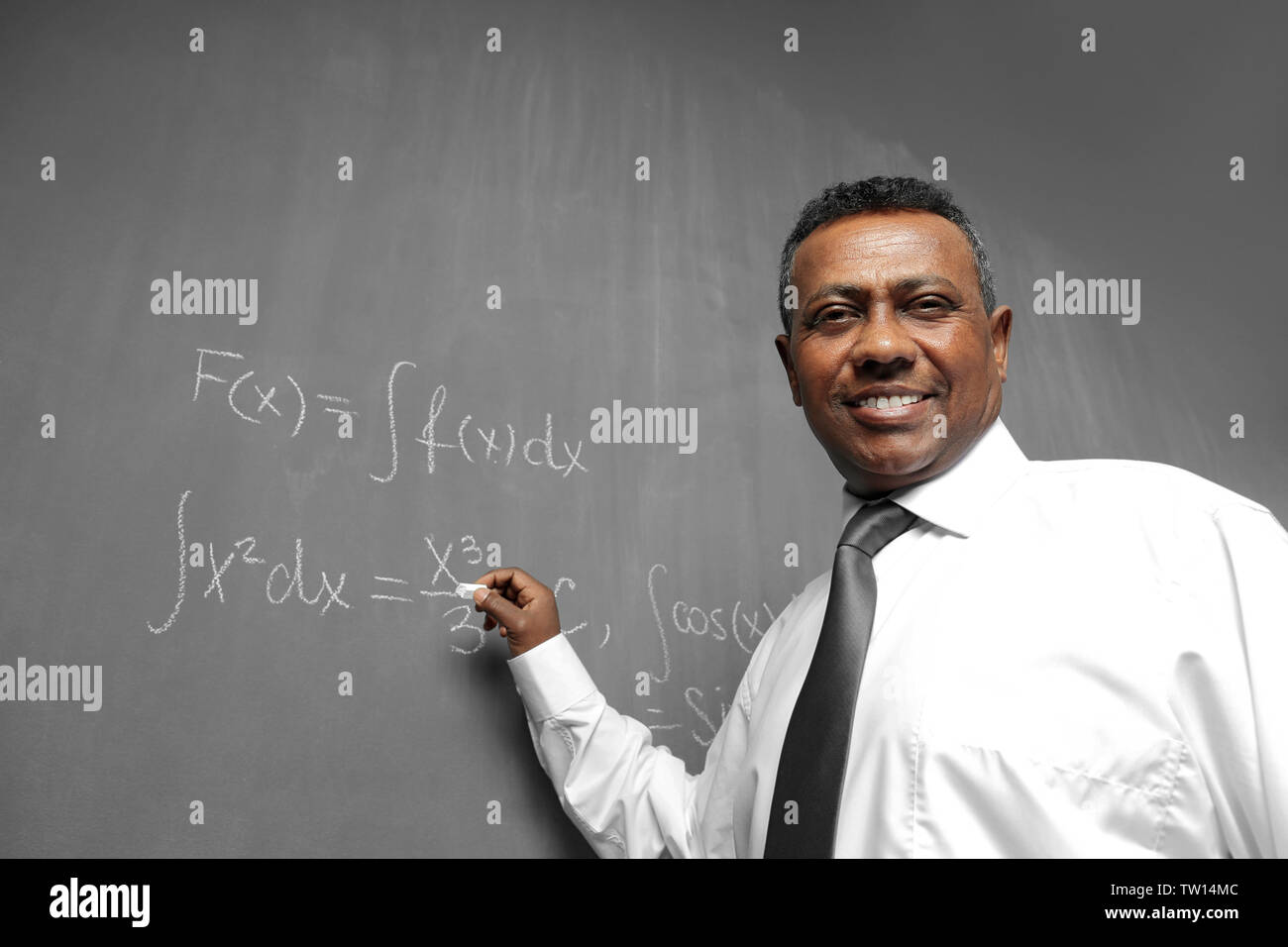 Teacher writing math formulas hi-res stock photography and images - Alamy
