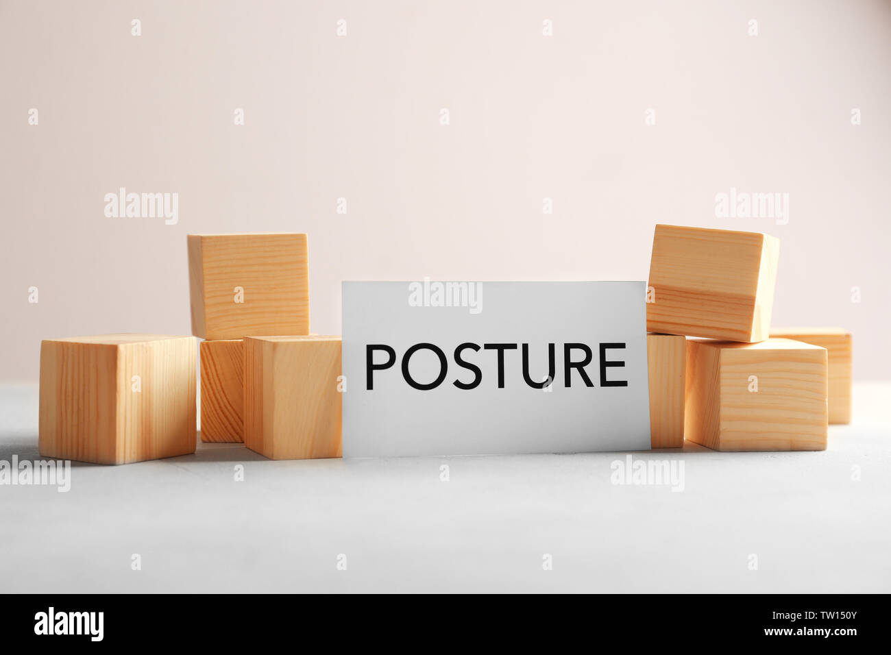 Paper with word POSTURE and wooden cubes on light background Stock ...