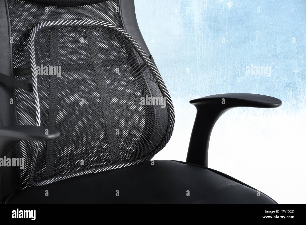 Office chair with mesh for back support on light background Stock Photo ...