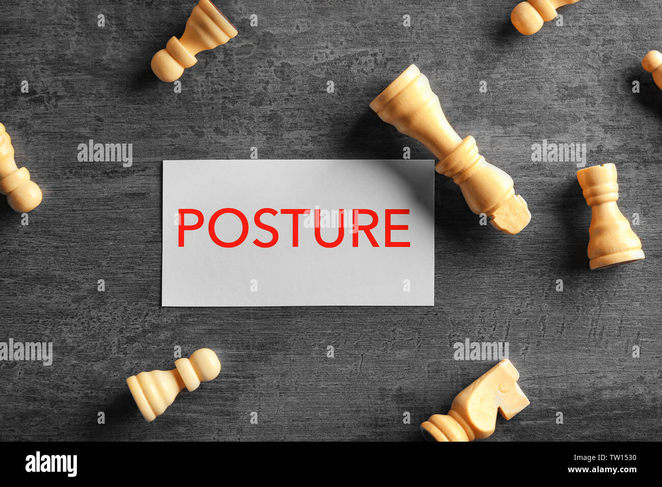 Paper with word POSTURE and chess pieces on gray background Stock Photo ...