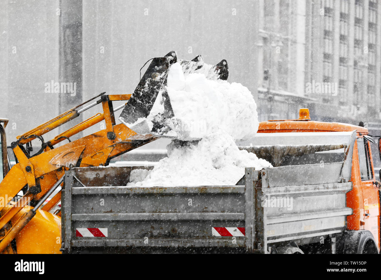Snow plow outdoors cleaning street Stock Photo - Alamy