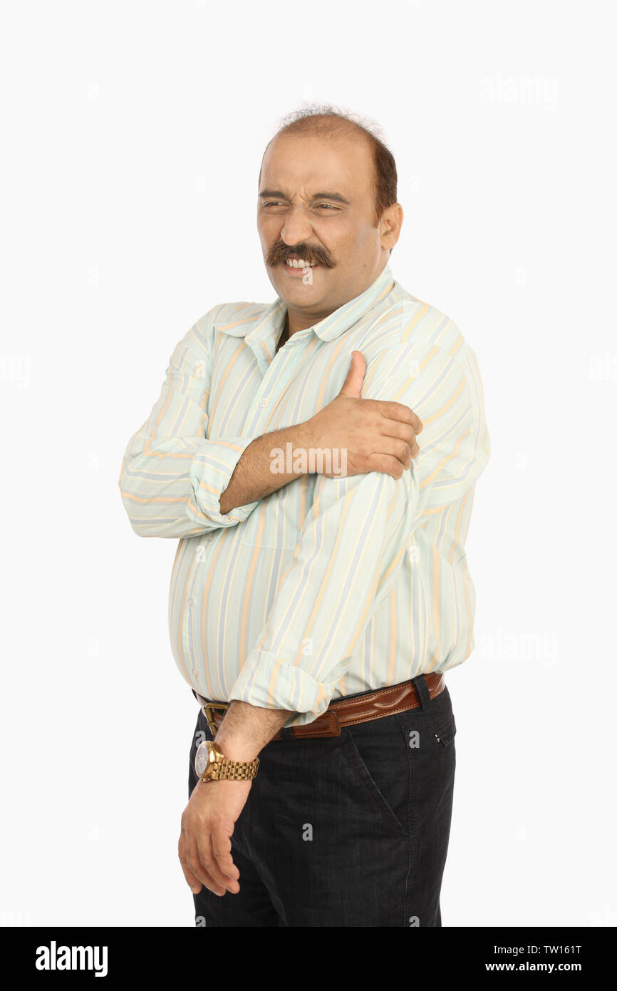 Side profile of a man suffering from hand pain Stock Photo - Alamy