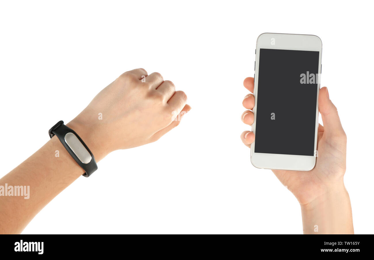 Hands with heart rate monitor watch and smartphone isolated on white ...