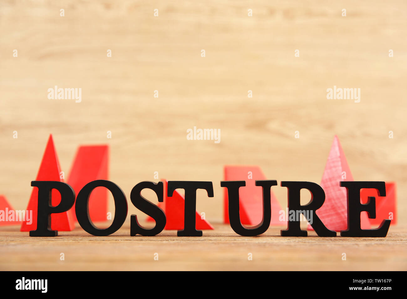 Black letters forming word POSTURE on wooden background Stock Photo - Alamy