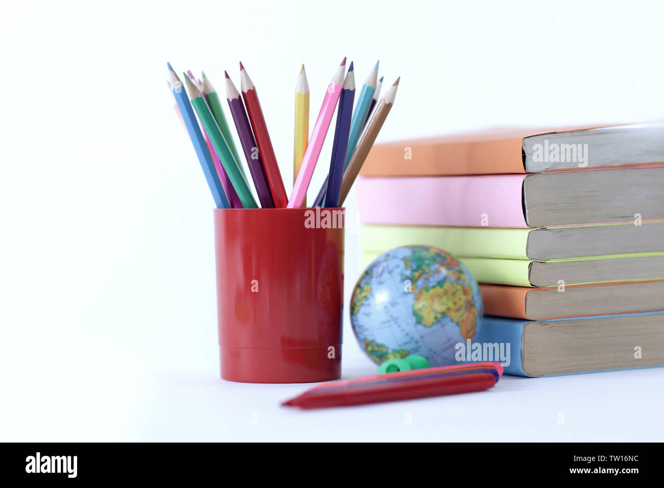 globe, books and pencils on white background .photo with copy space ...
