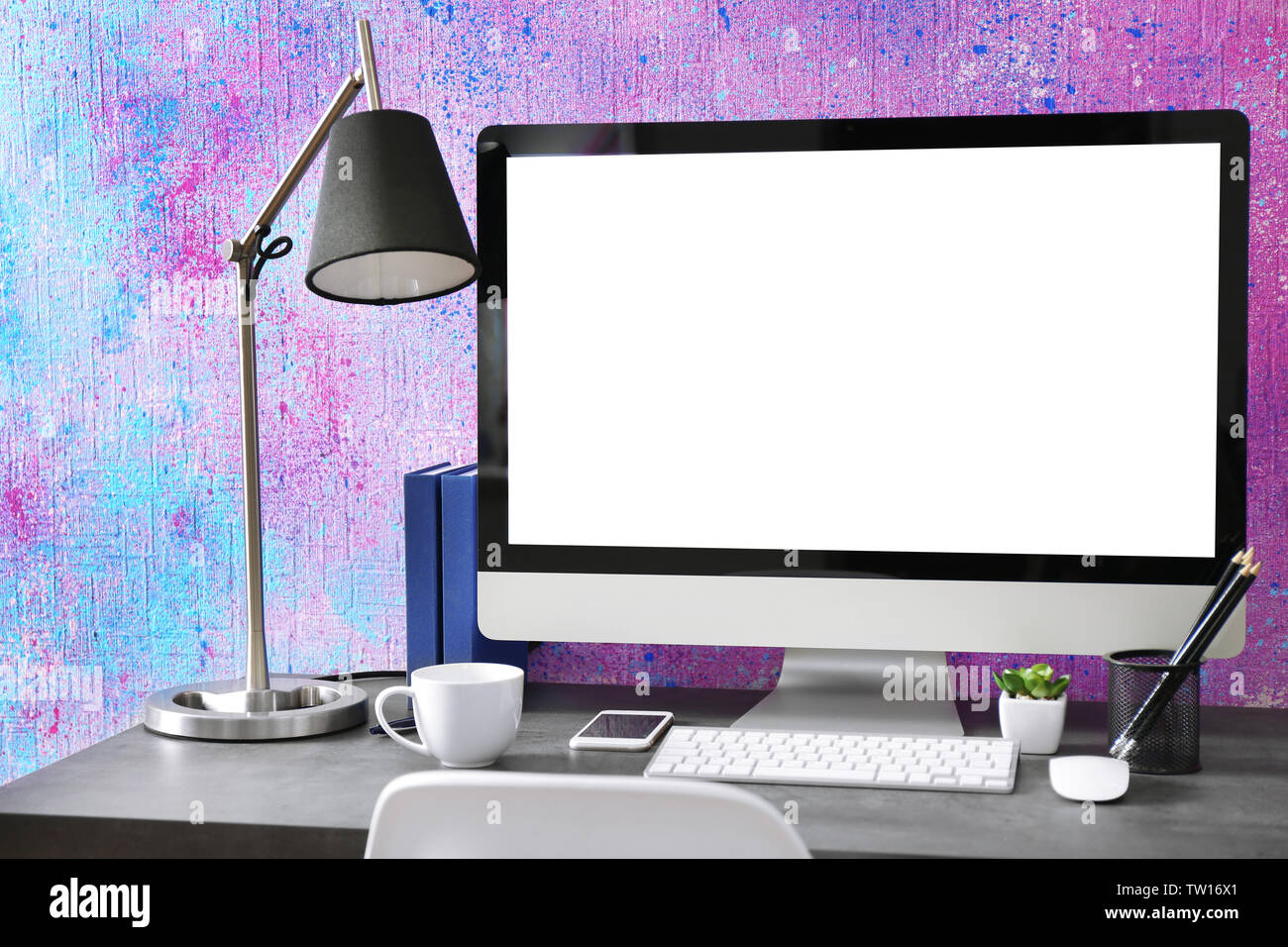 Workplace with computer on table in modern room Stock Photo - Alamy