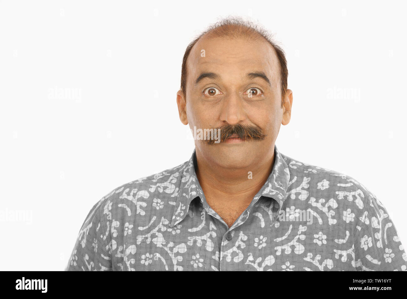Portrait of an Indian man looking surprised Stock Photo - Alamy