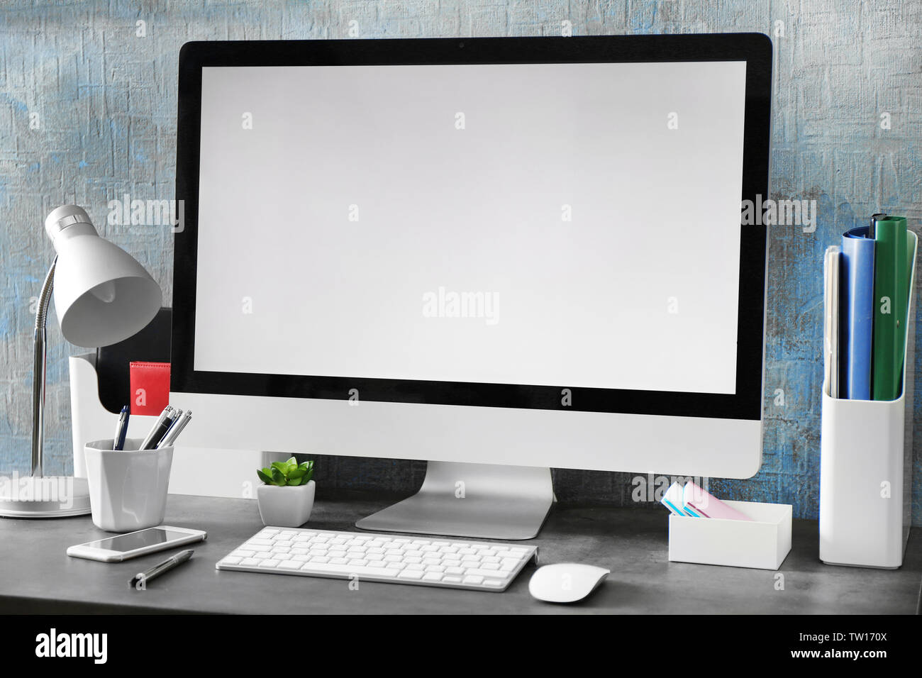 Workplace with computer on table in modern room Stock Photo - Alamy