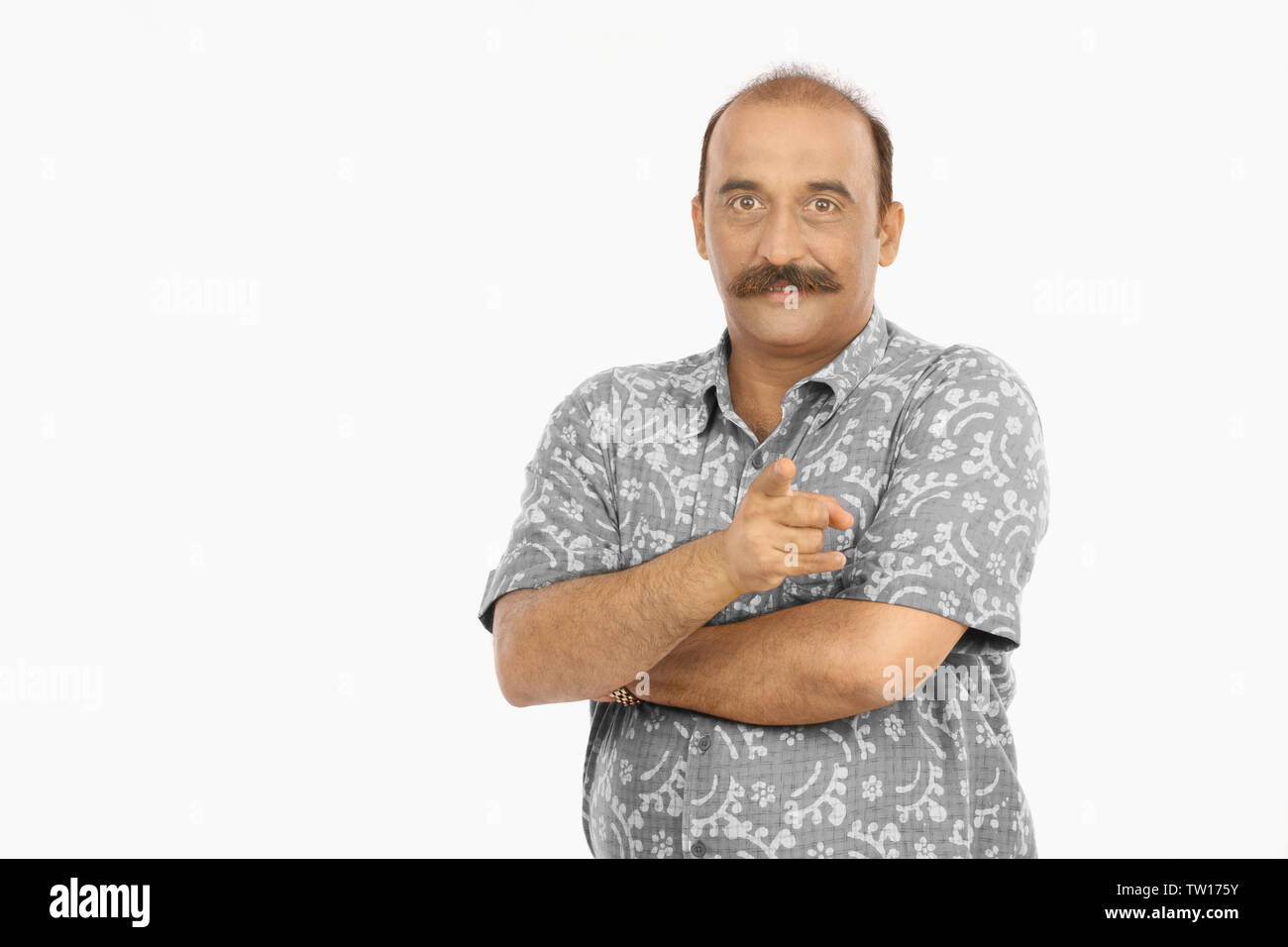 Portrait of an Indian man pointing Stock Photo - Alamy