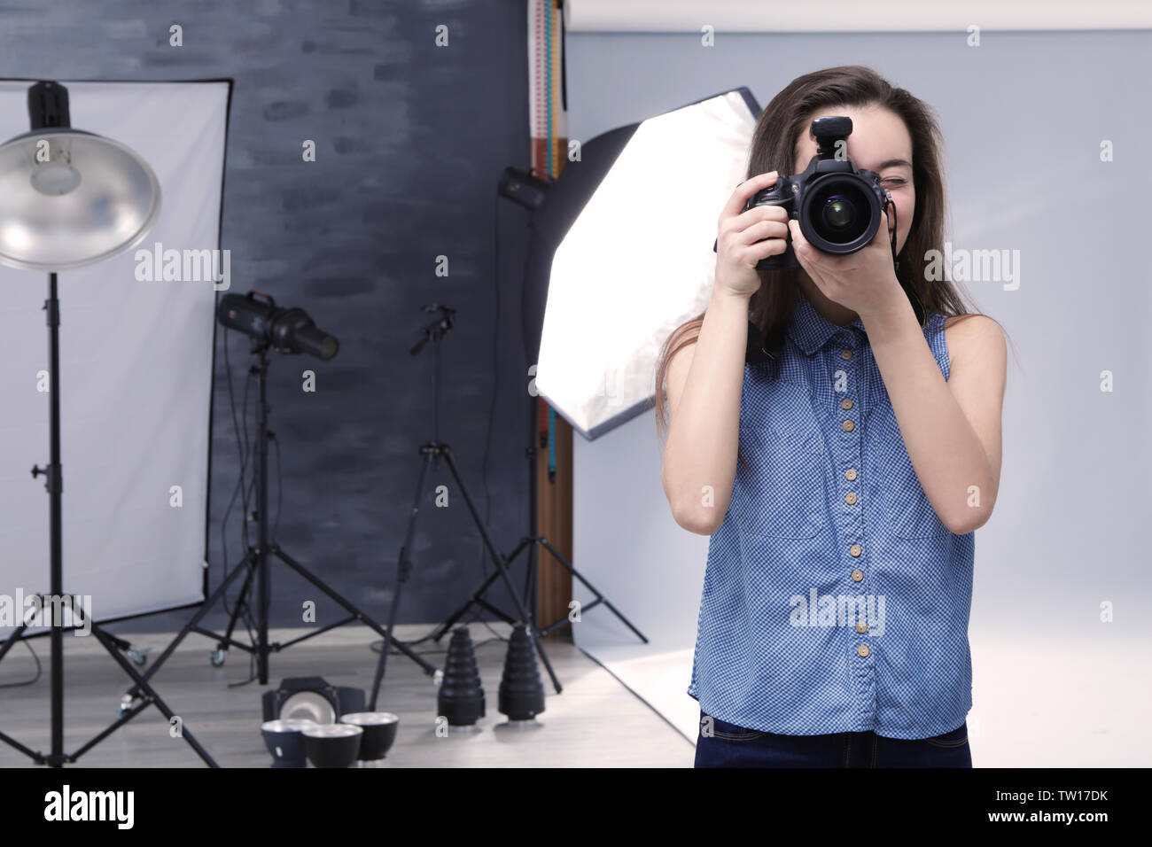 Young photographer in process working hi-res stock photography and ...