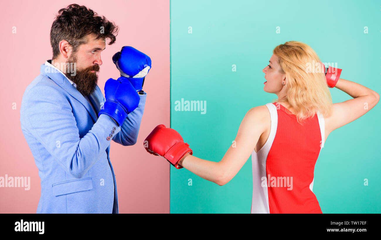 Gender equality. Man formal suit and athletic woman boxing fight ...