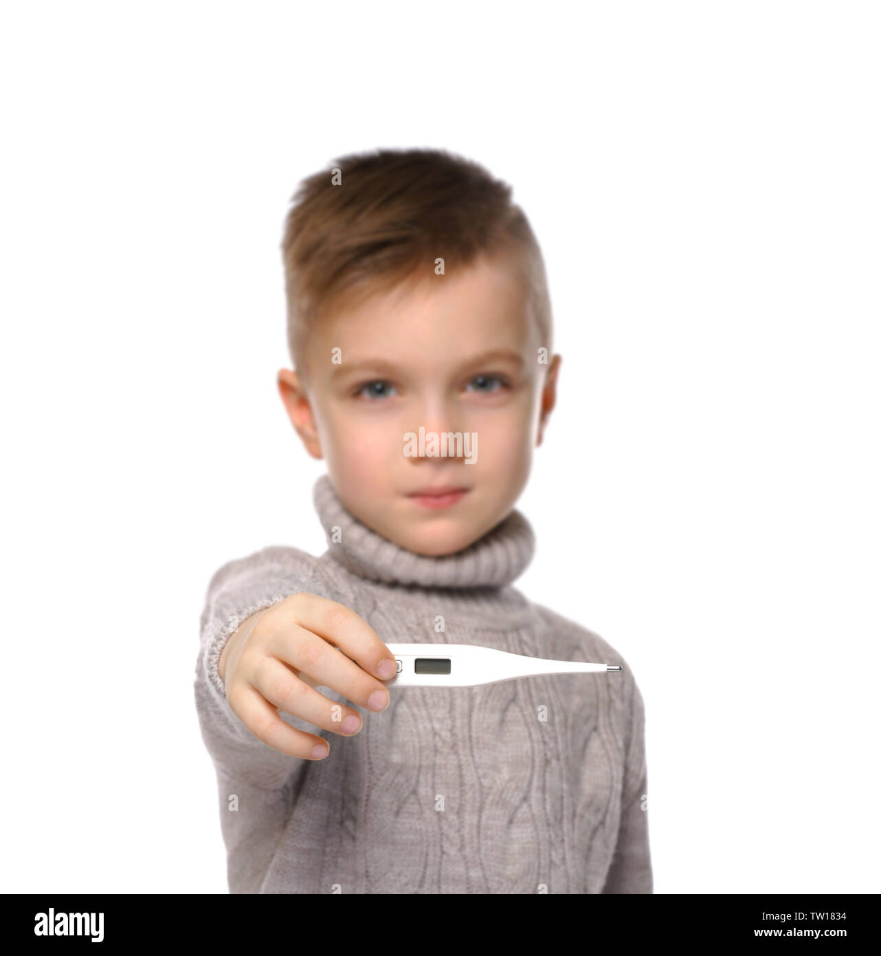 Cute little boy showing thermometer on white background Stock Photo - Alamy