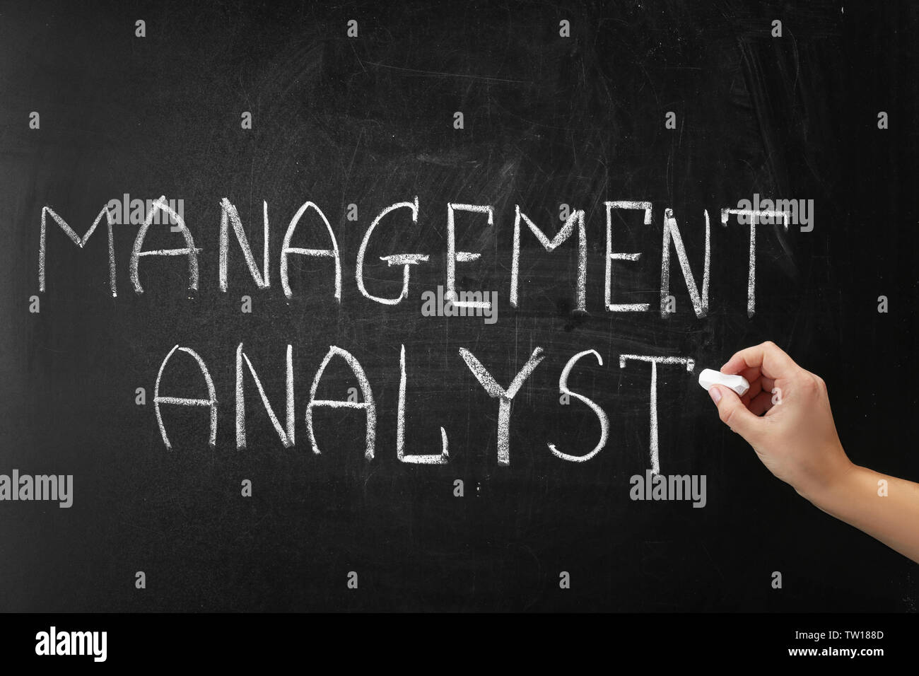 Hand writing phrase MANAGEMENT ANALYST on blackboard Stock Photo - Alamy