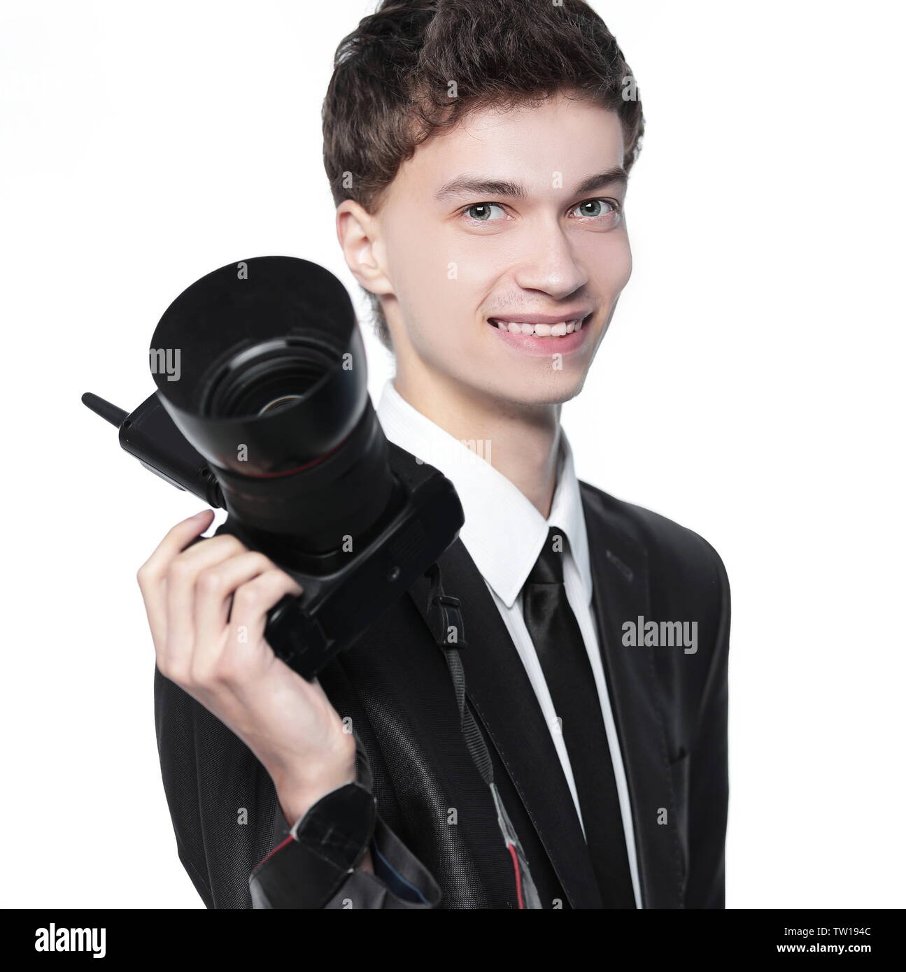 Portrait of young handsome photographer holding the camera.isolated on ...