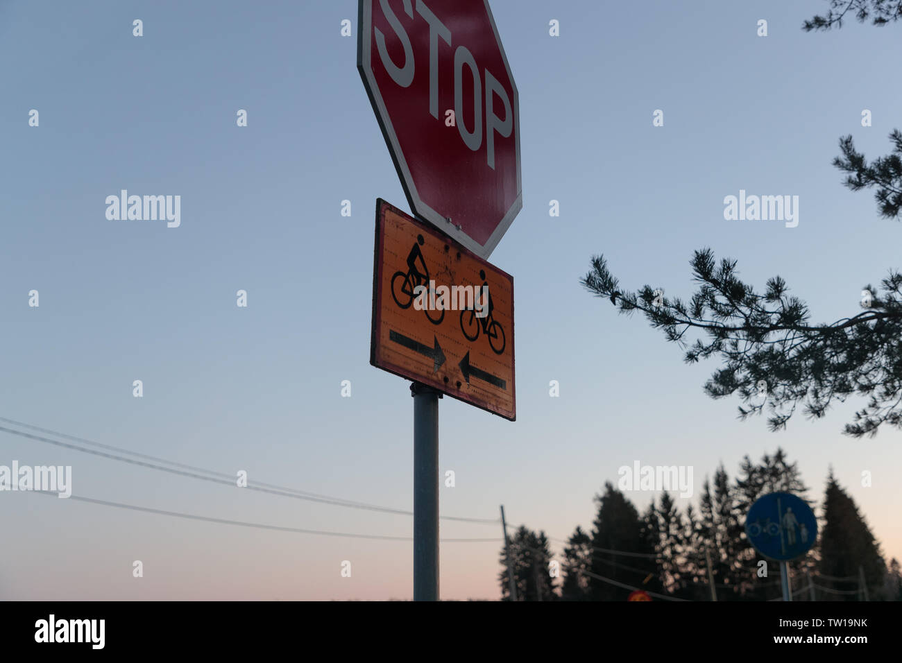 road stop sign and cyclist traffic Stock Photo - Alamy