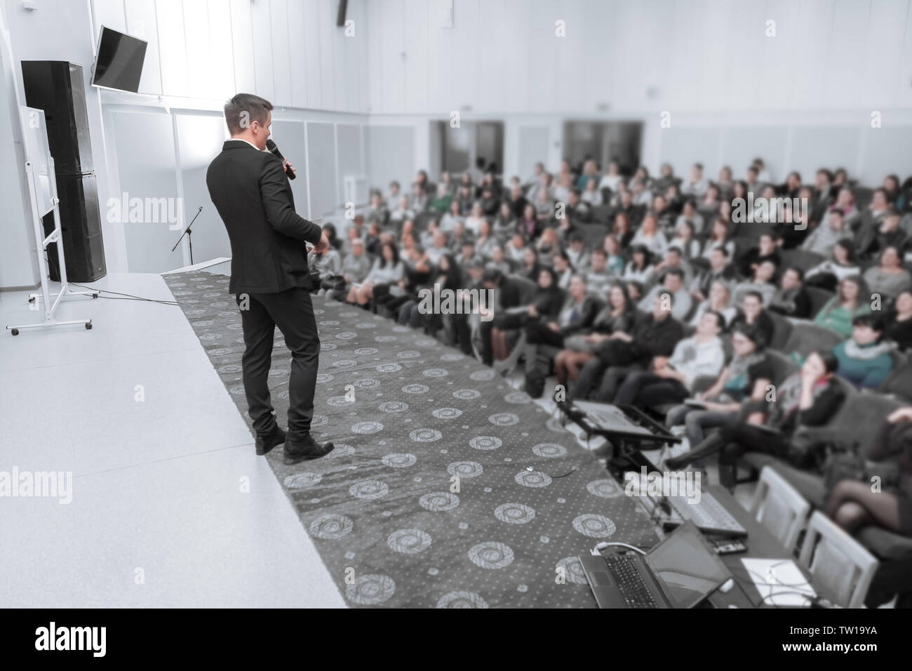 businessman man standing on stage during a press conference. business ...