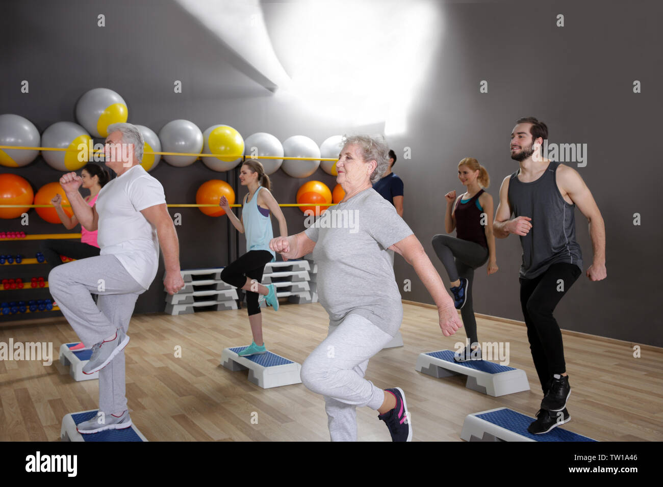 People of different ages training in gym Stock Photo - Alamy
