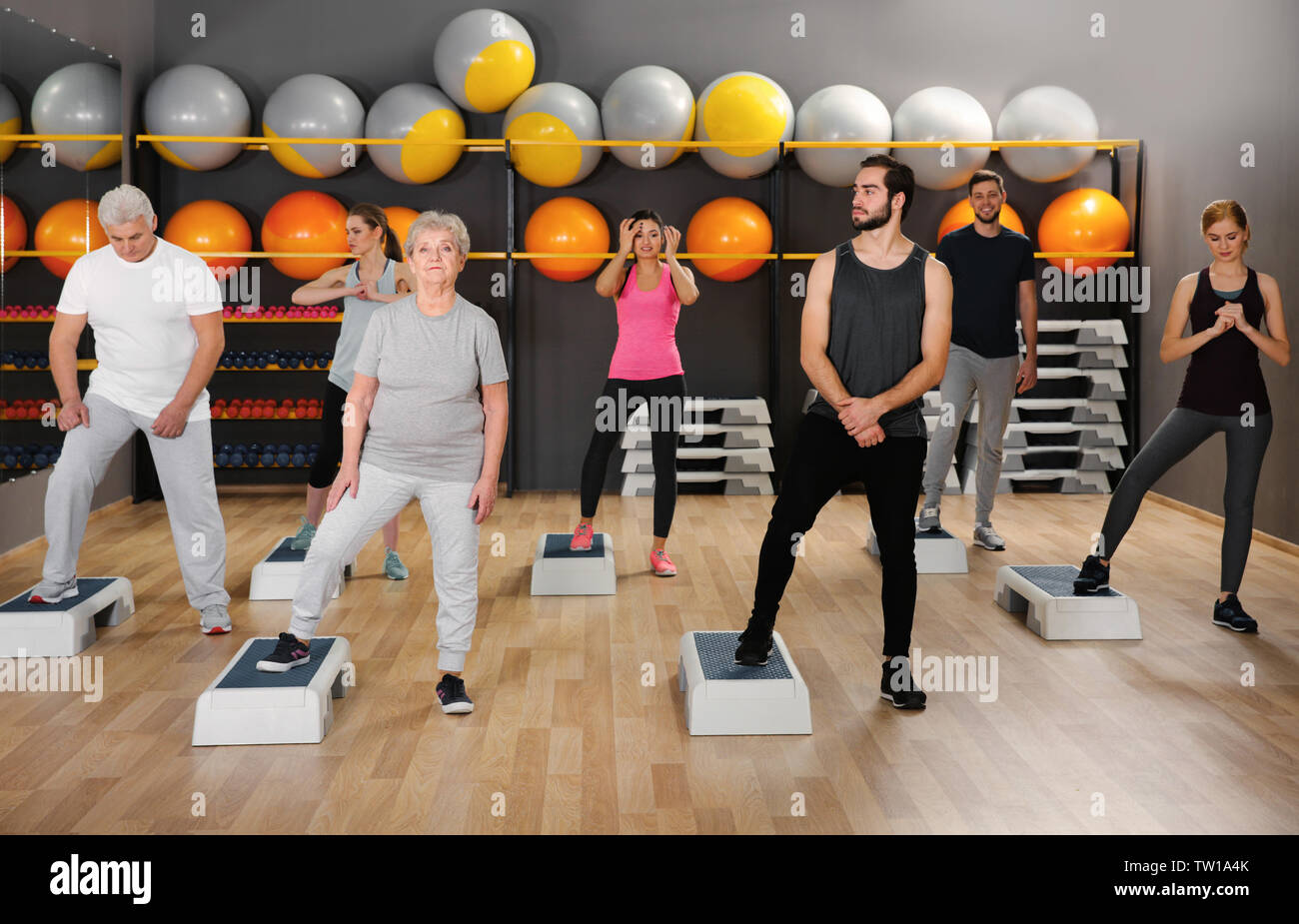 People of different ages training in gym Stock Photo - Alamy