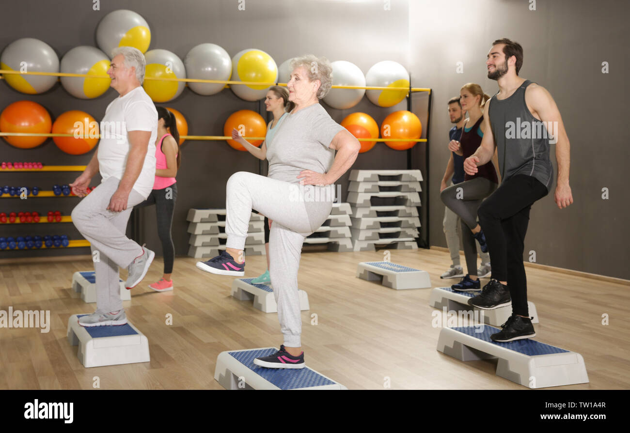 People of different ages training in gym Stock Photo - Alamy