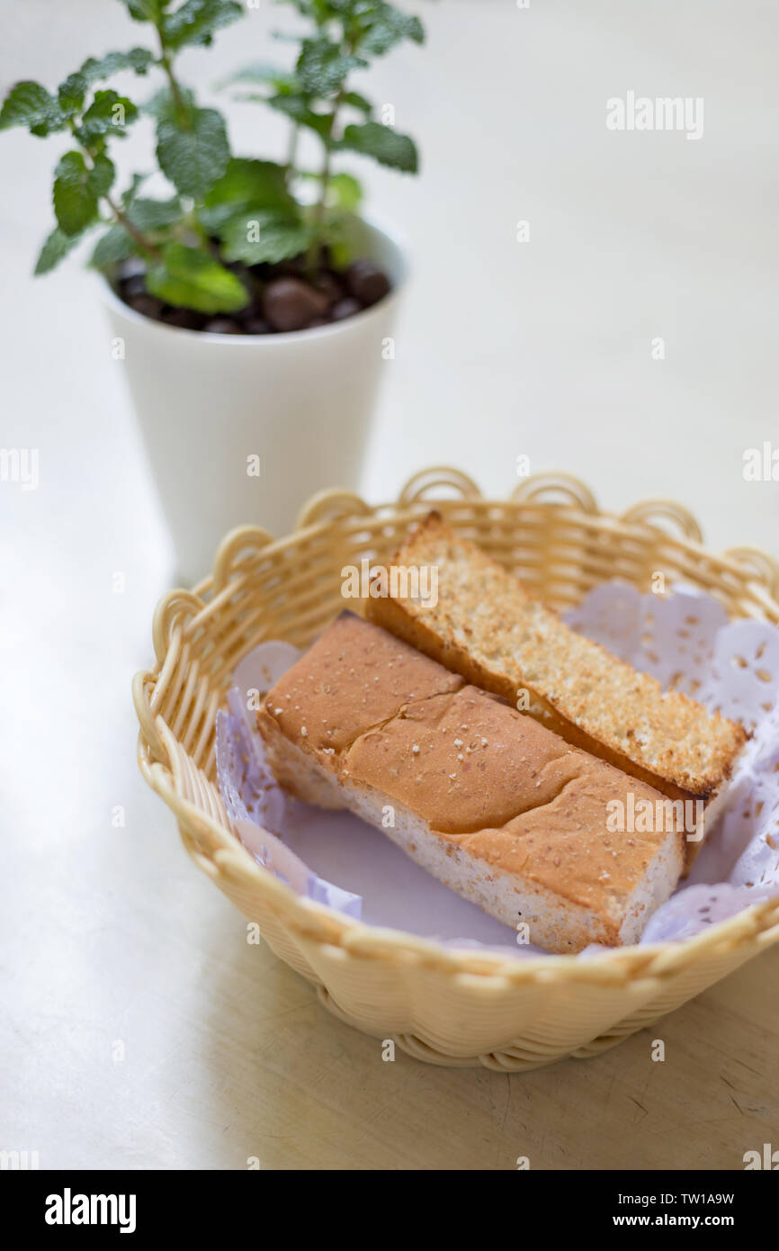 Composition with bread and plant isolated on white Stock Photo - Alamy