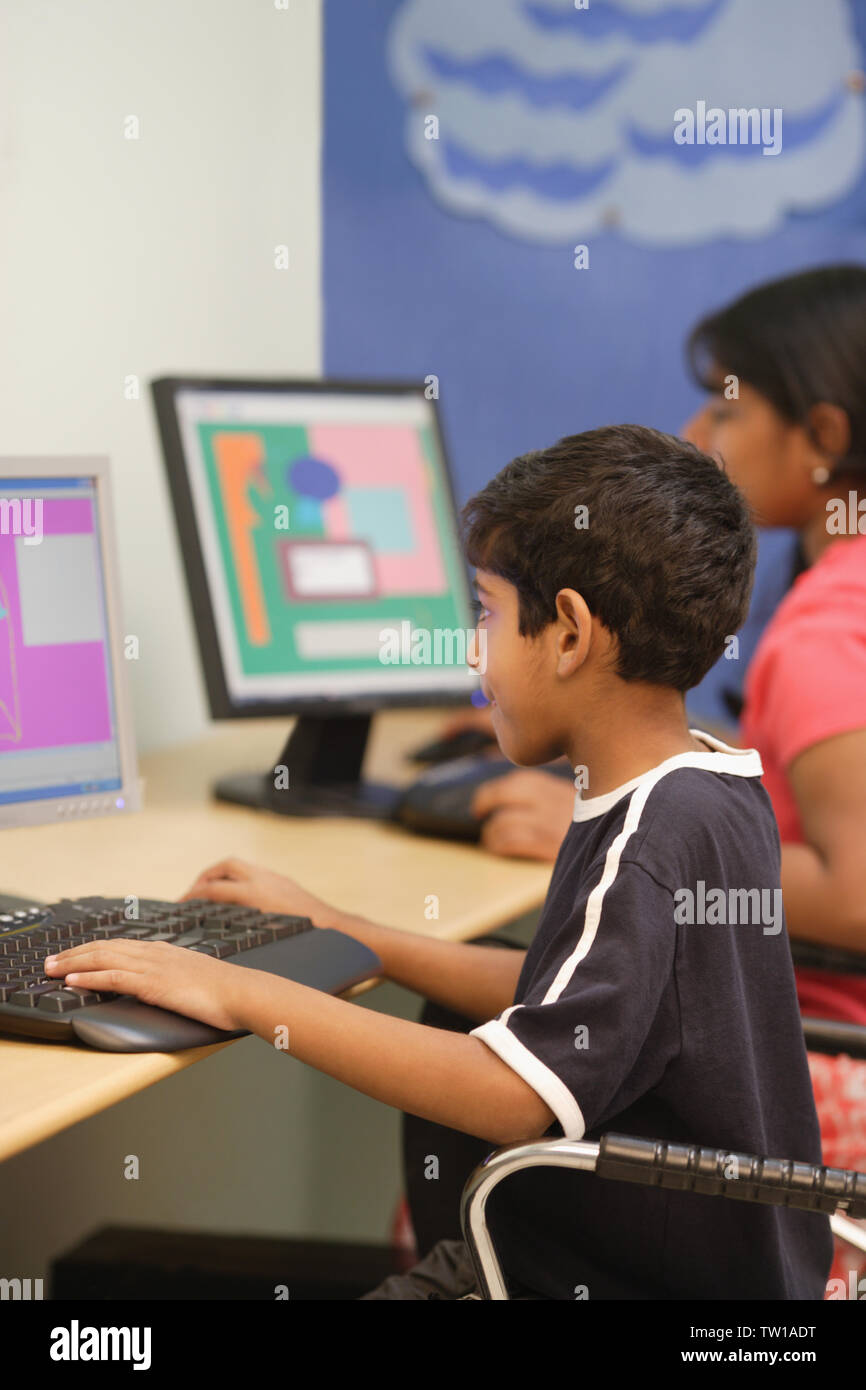 Students using computer in a classroom Stock Photo - Alamy