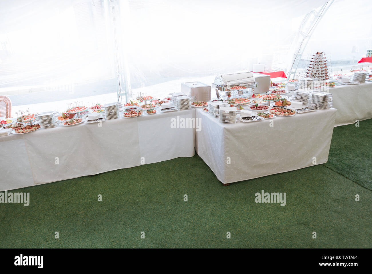 Cutlery and various dishes on the handout table in the modern ...