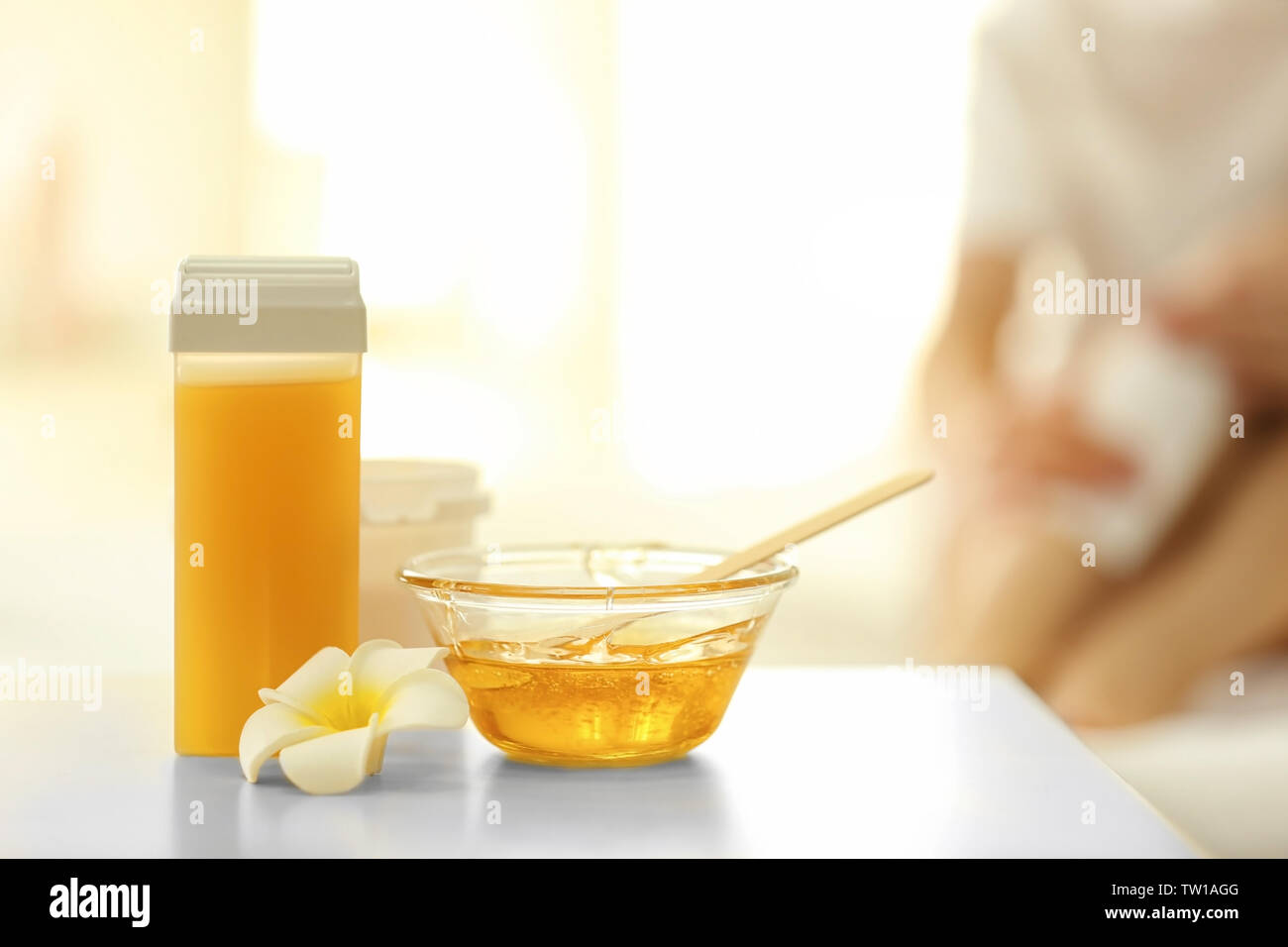 Wax depilation set on table in spa center Stock Photo - Alamy