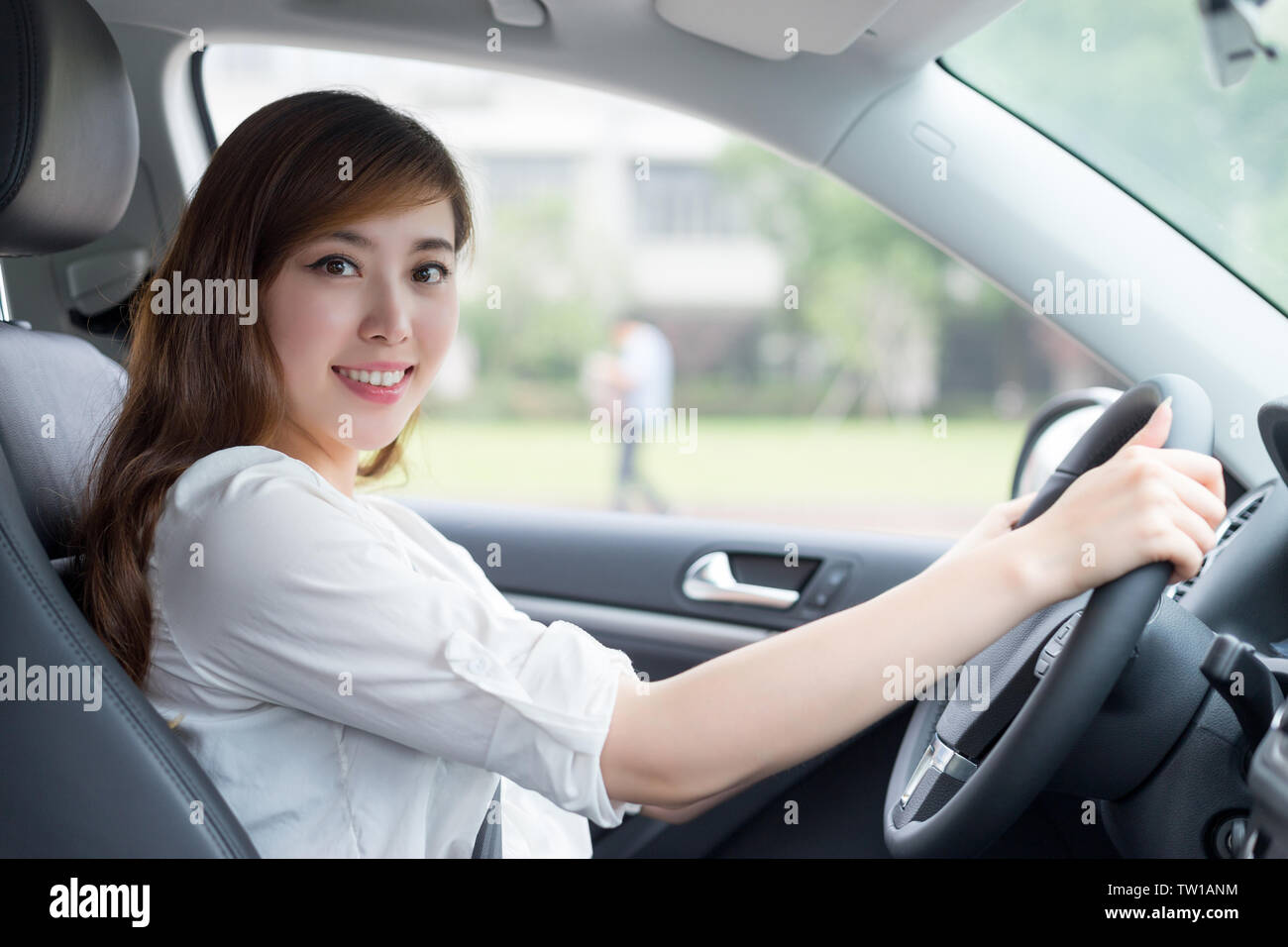 Asian beautiful woman driving car portrait Stock Photo - Alamy