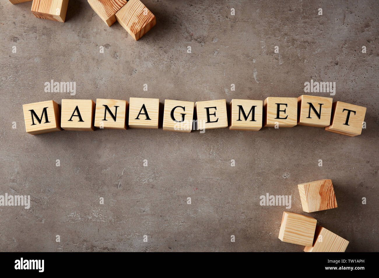 Wooden cubes with word MANAGEMENT on color background Stock Photo - Alamy