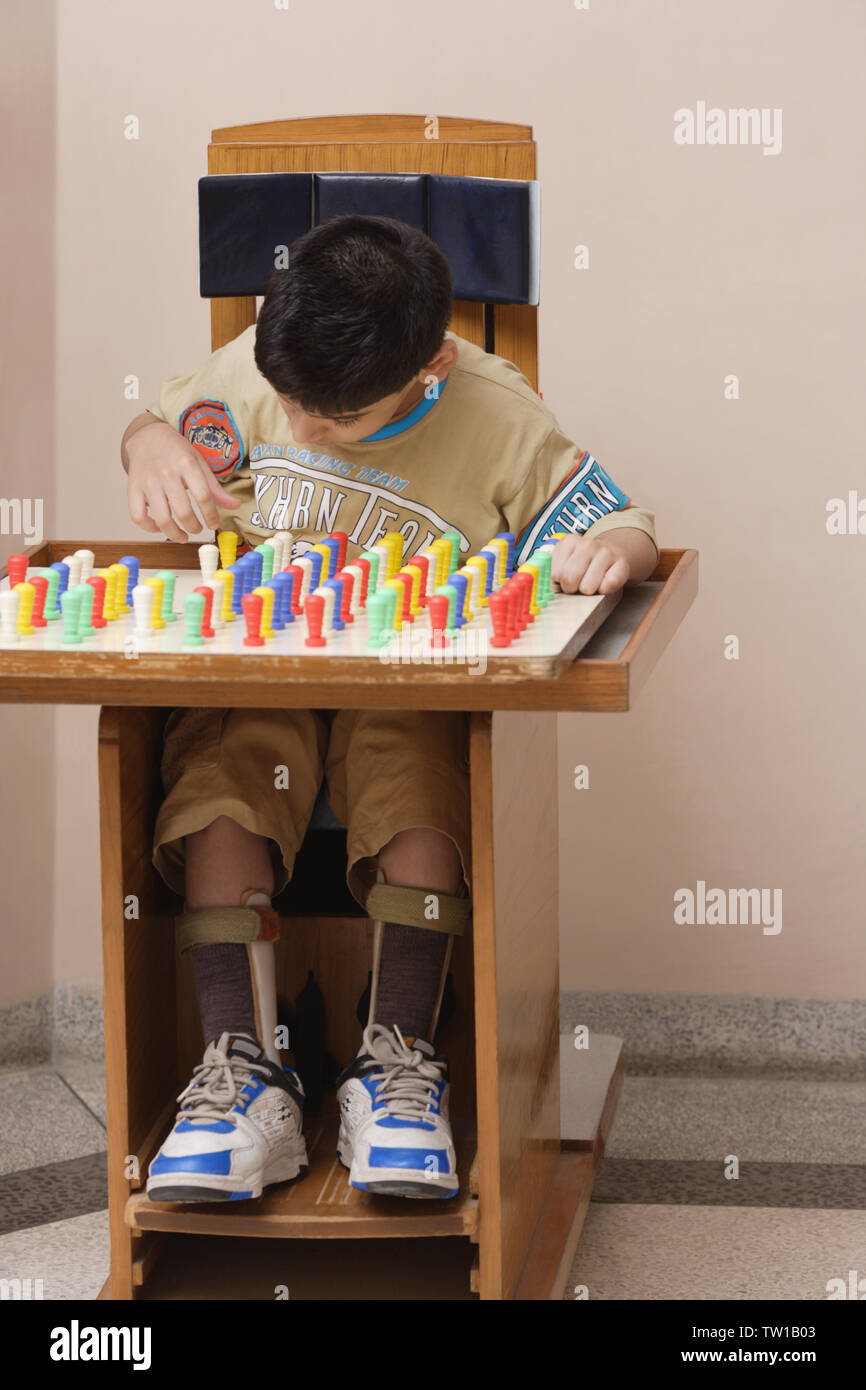 Boy learning in a classroom Stock Photo - Alamy