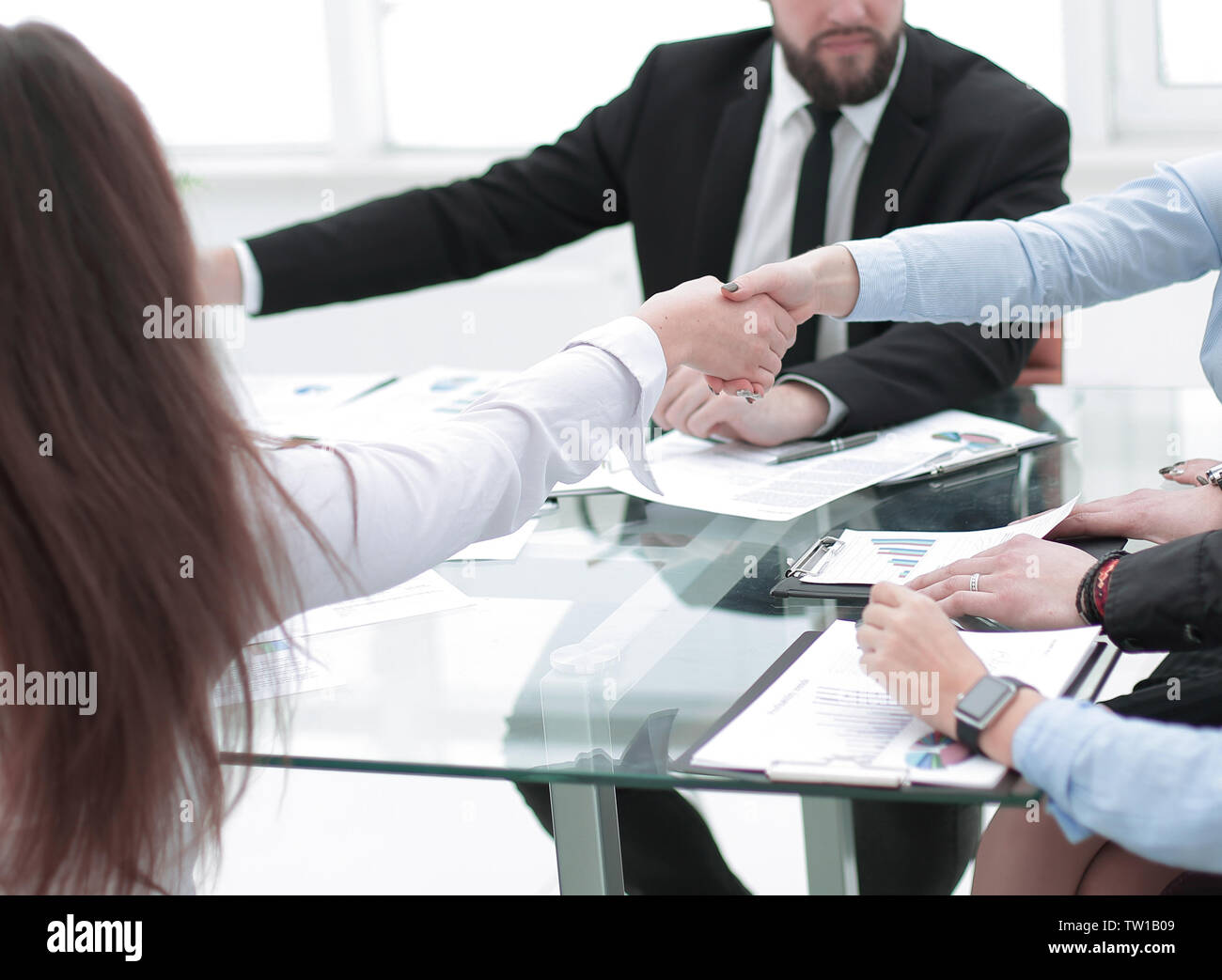 colleagues confirming the job with a handshake.teamwork Stock Photo - Alamy