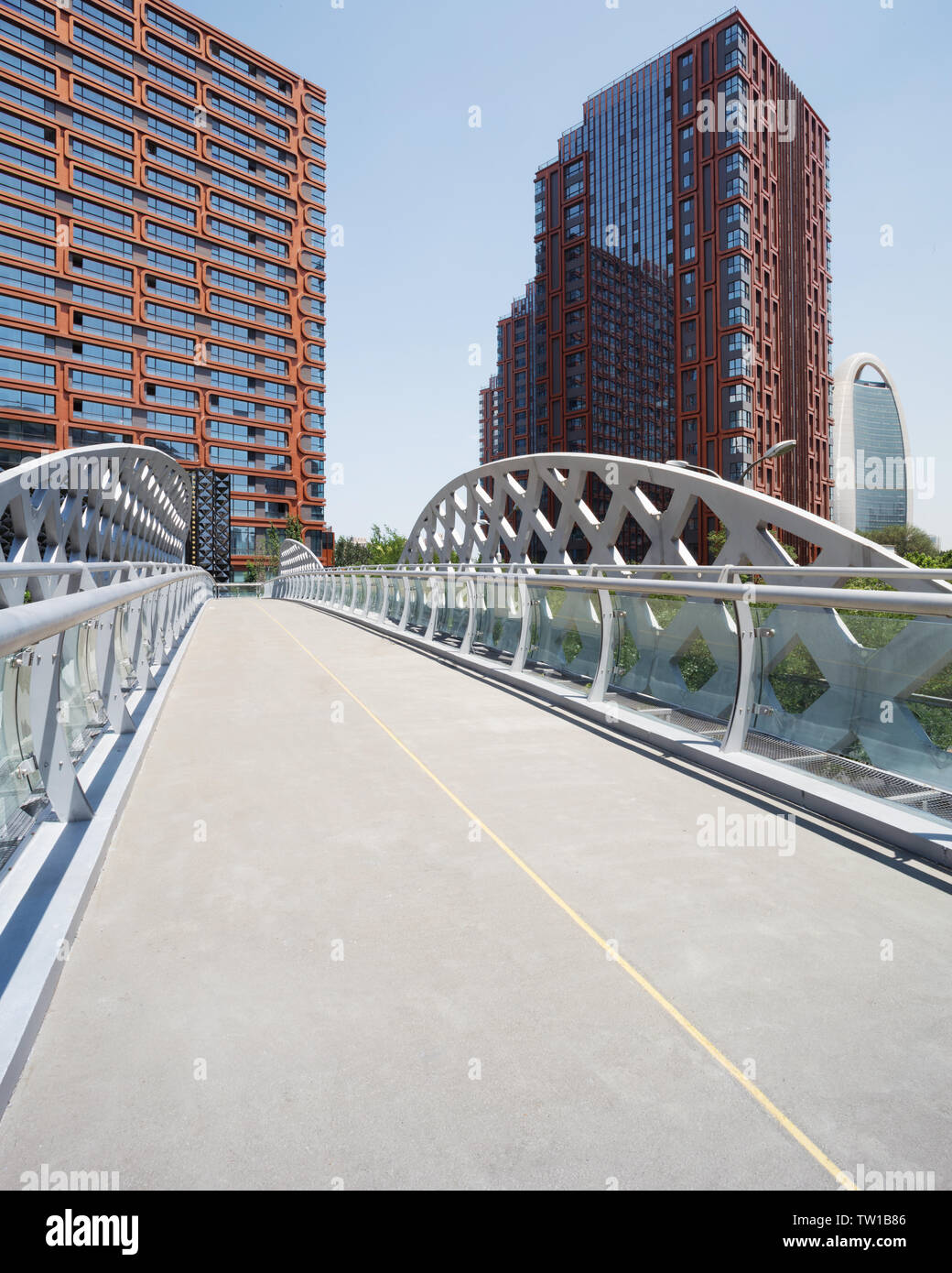 footbridge and office building in modern city Stock Photo - Alamy