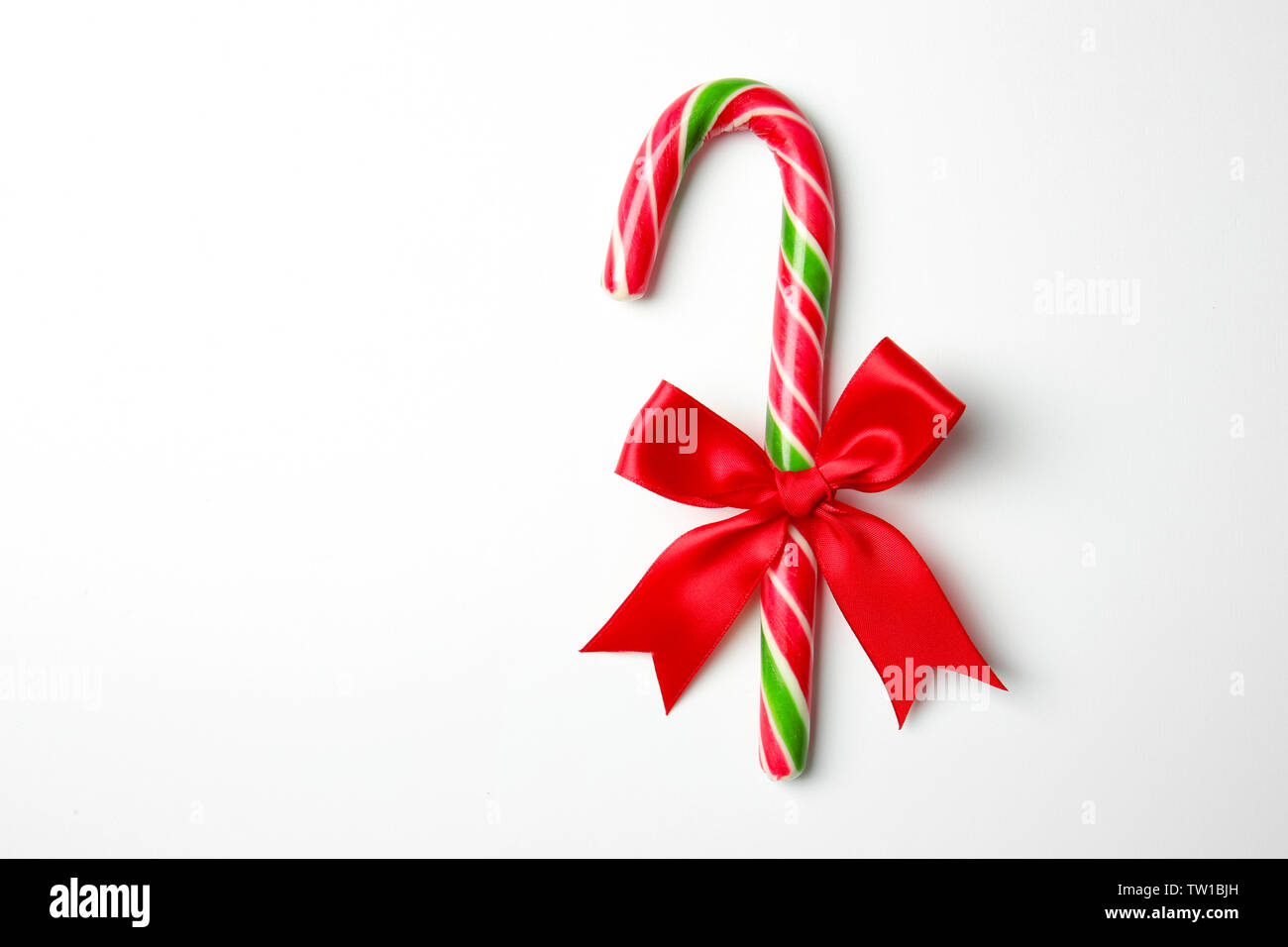Christmas candy cane on white background Stock Photo - Alamy