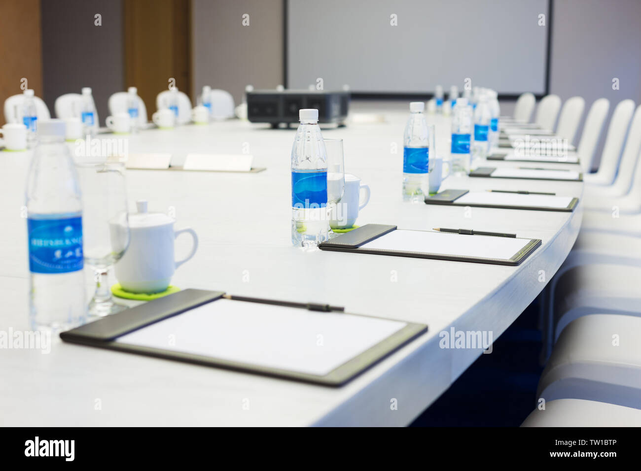 white big table in modern meeting room Stock Photo - Alamy