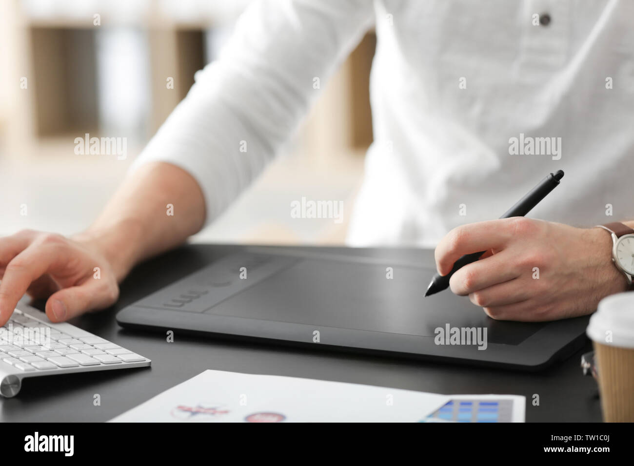 Male hands using graphics tablet Stock Photo - Alamy
