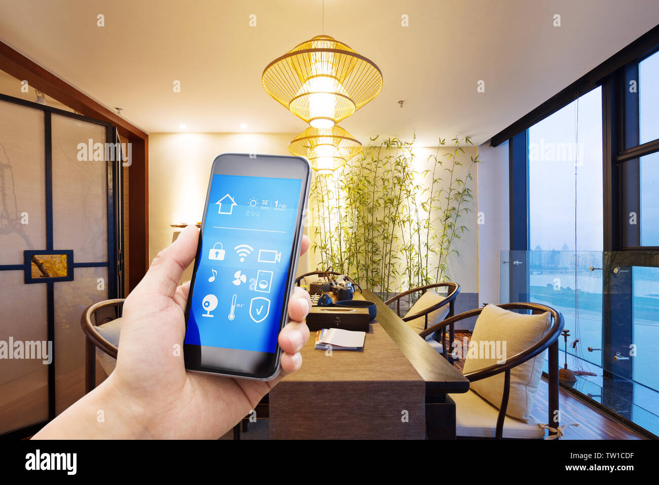 smart phone with smart home with modern dining room Stock Photo - Alamy