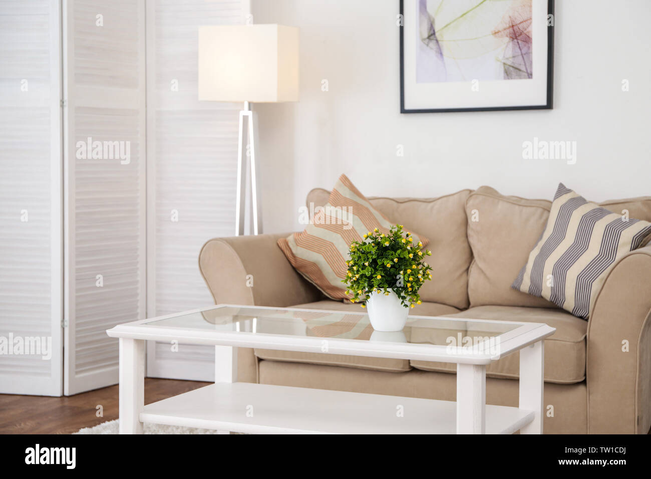 Interior of beautiful living room with folding screen and sofa Stock ...