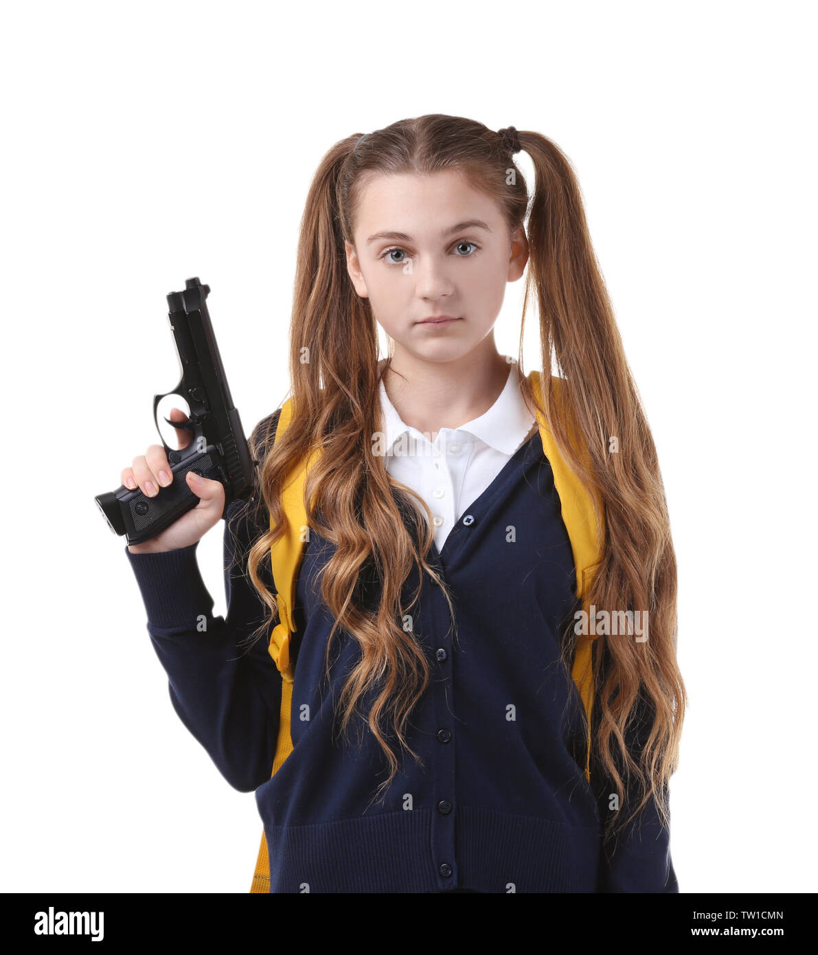Teenage girl holding gun on white background Stock Photo - Alamy