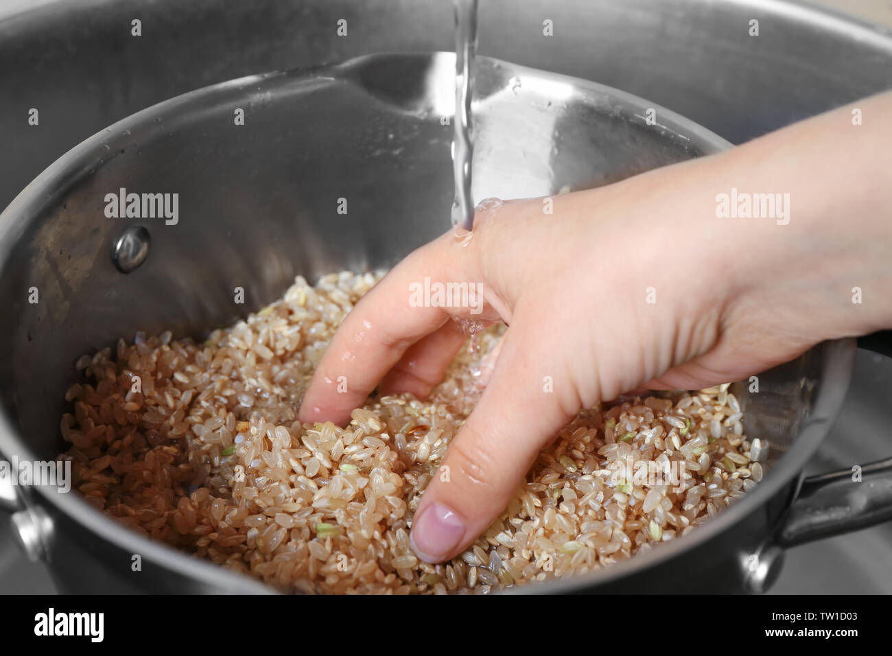 Hand washing rice grains in hi-res stock photography and images - Alamy