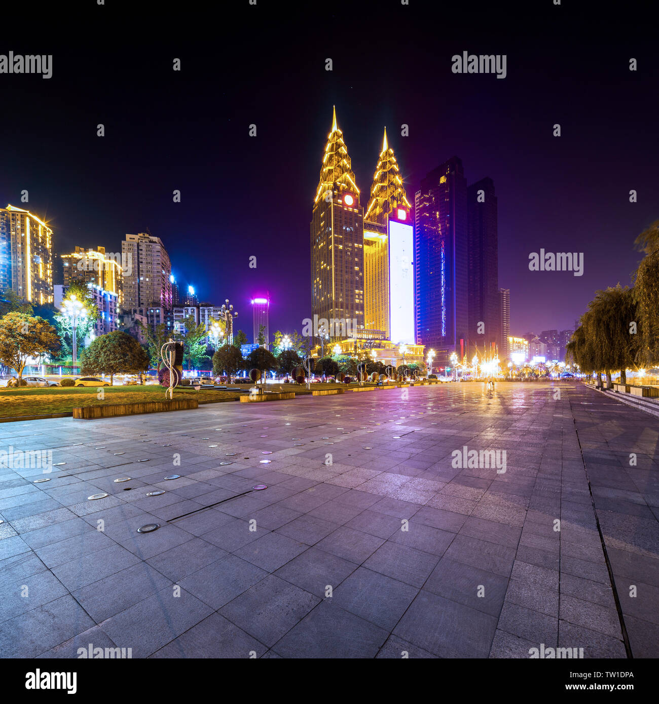 Empty floor and illuminated skyscraper Stock Photo - Alamy