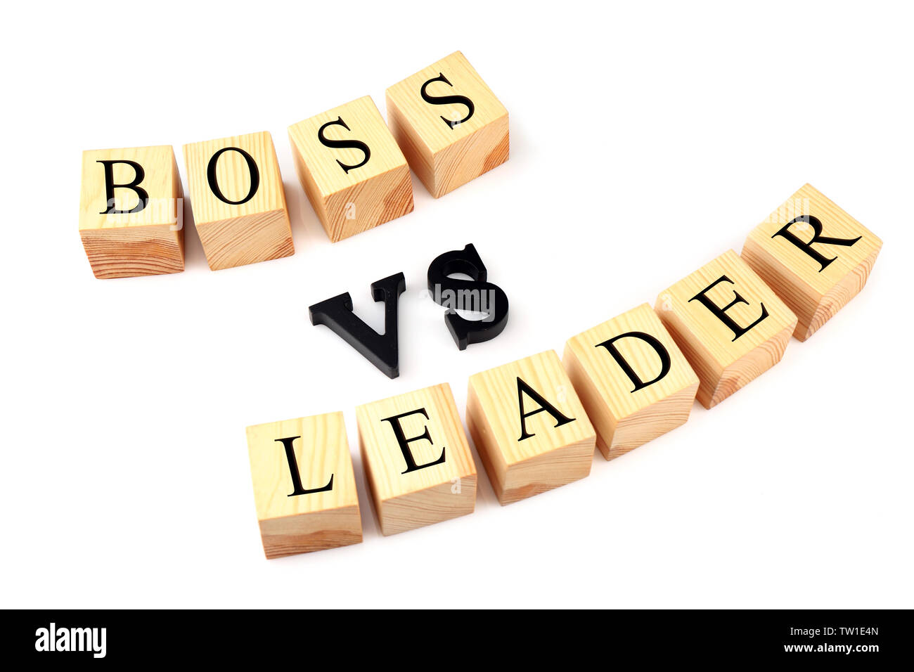 Wooden cubes and black letters forming text BOSS VS LEADER isolated on ...