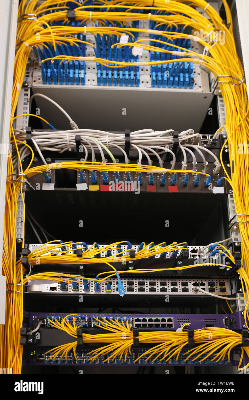 View of open cabinet with wires in server room Stock Photo - Alamy