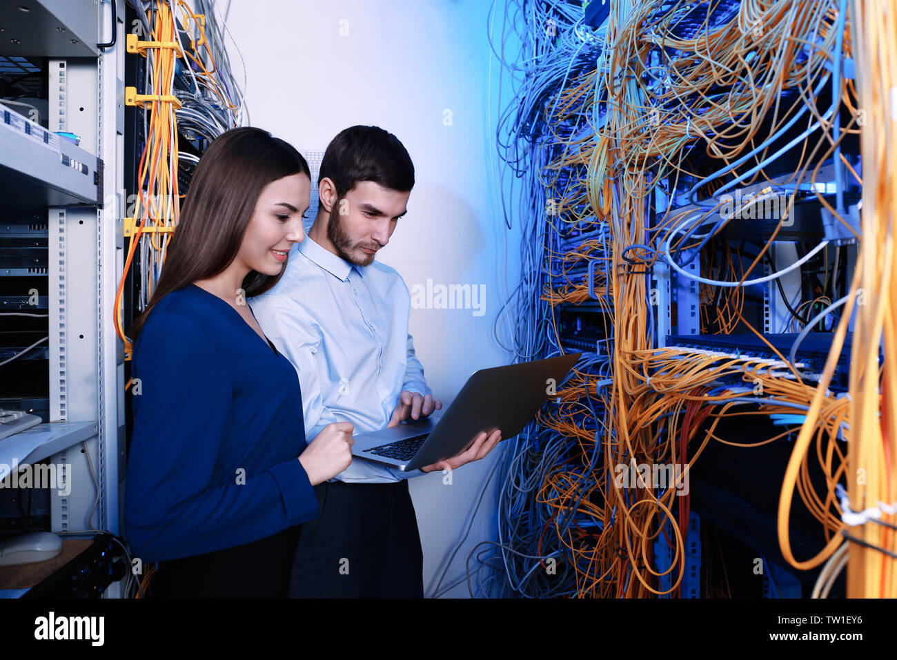 Male female data center engineers hi-res stock photography and images ...
