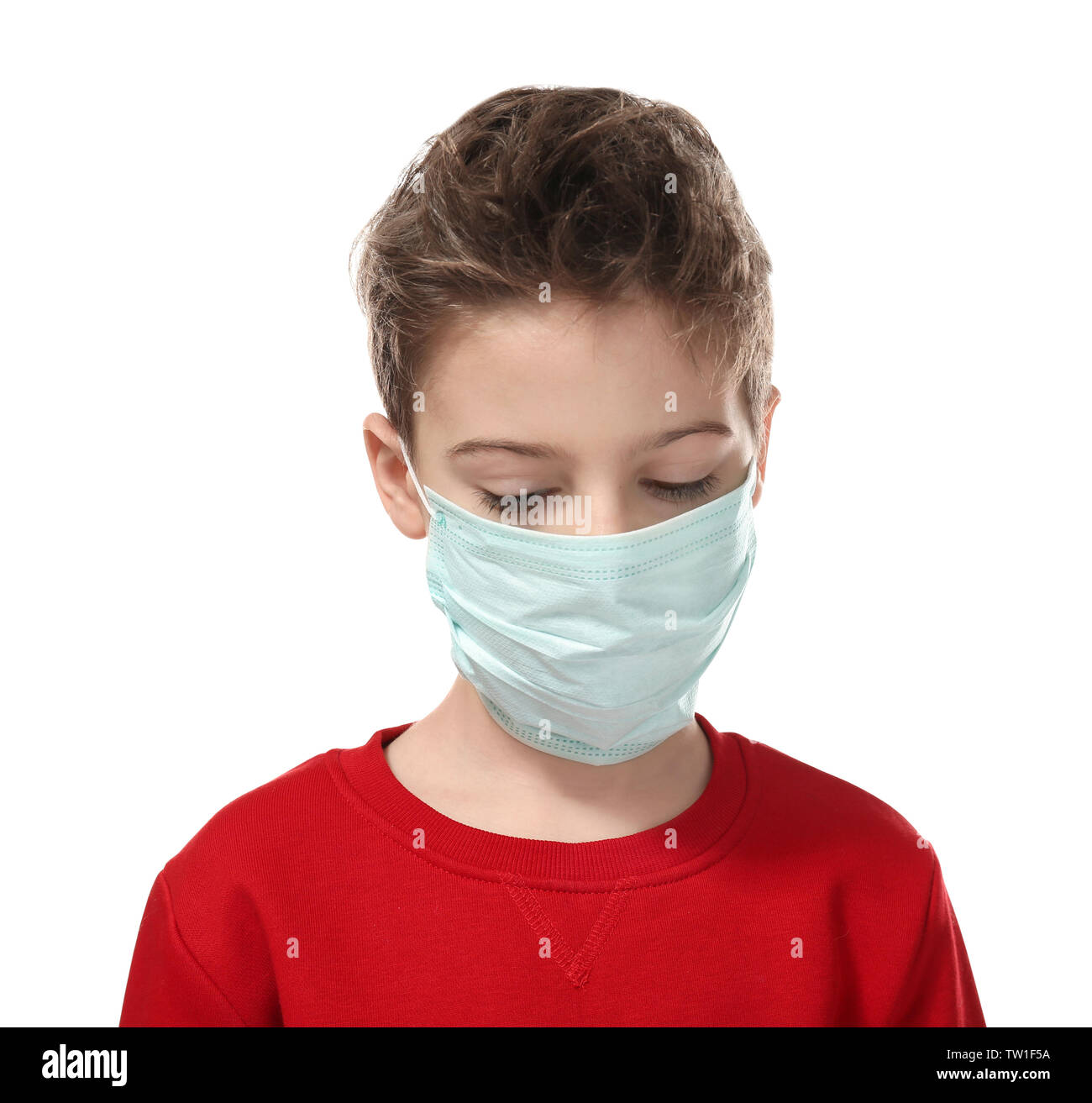 Little boy with flu in facial mask on white background Stock Photo - Alamy